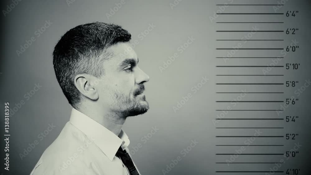 Mugshot of prisoner, male criminal getting photographed at police ...