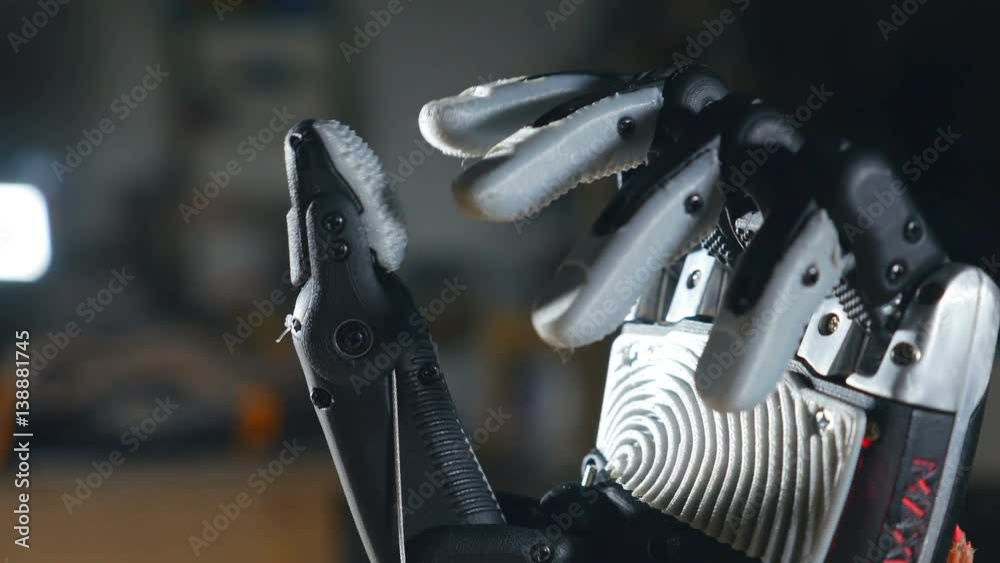 Real innovative bionic cybernetic man gesturing. Futuristic arm moving ...