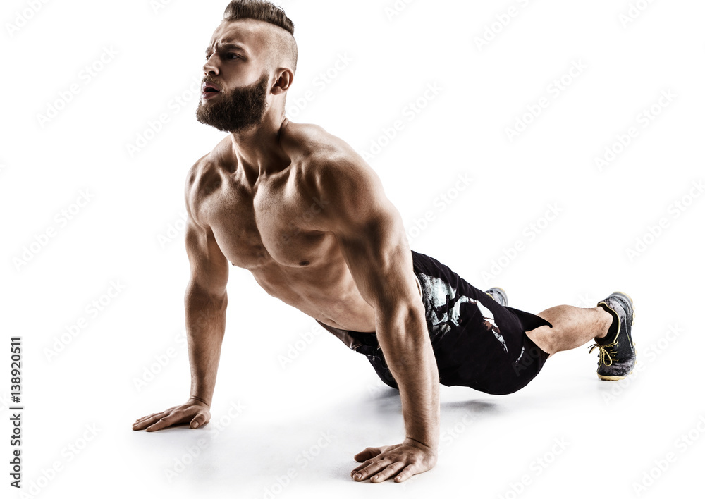 Handsome man doing push-ups exercises from the floor. Photo muscular ...