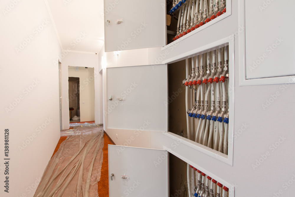 Fotka „Plumbing white plastic pipes, fittings and ball valves are ...