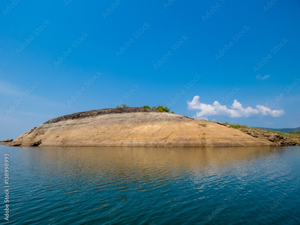 Rock formed island yellow stone in Inginiyagala Senanayake Samudraya ...