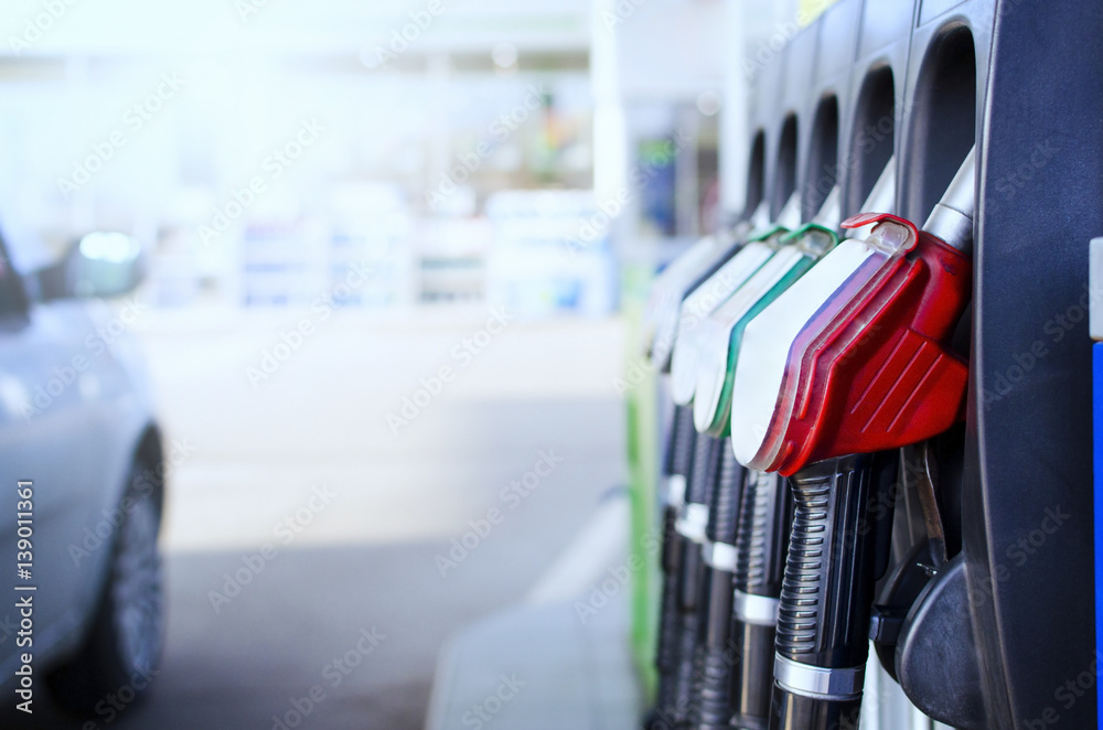 Gas station. Fuel dispenser and car ready to be filled up at petrol ...