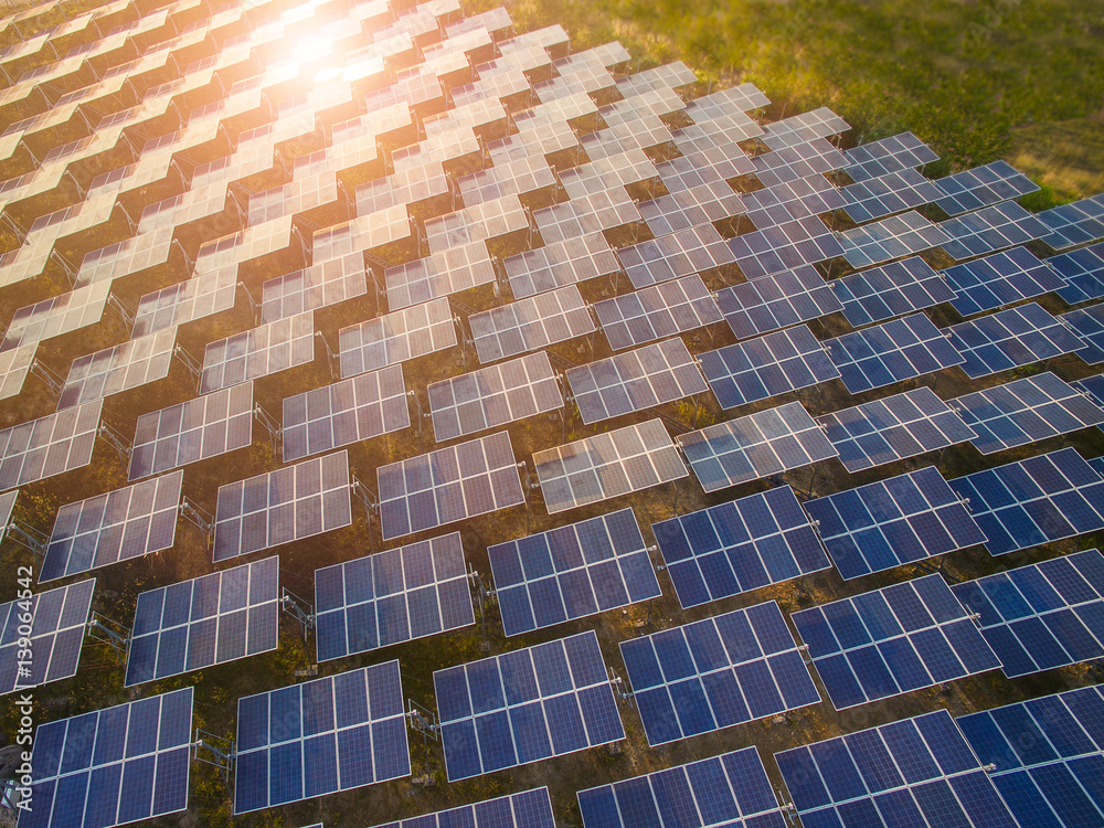 Photo & Art Print Solar panels (solar cell) in solar farm with sun ...