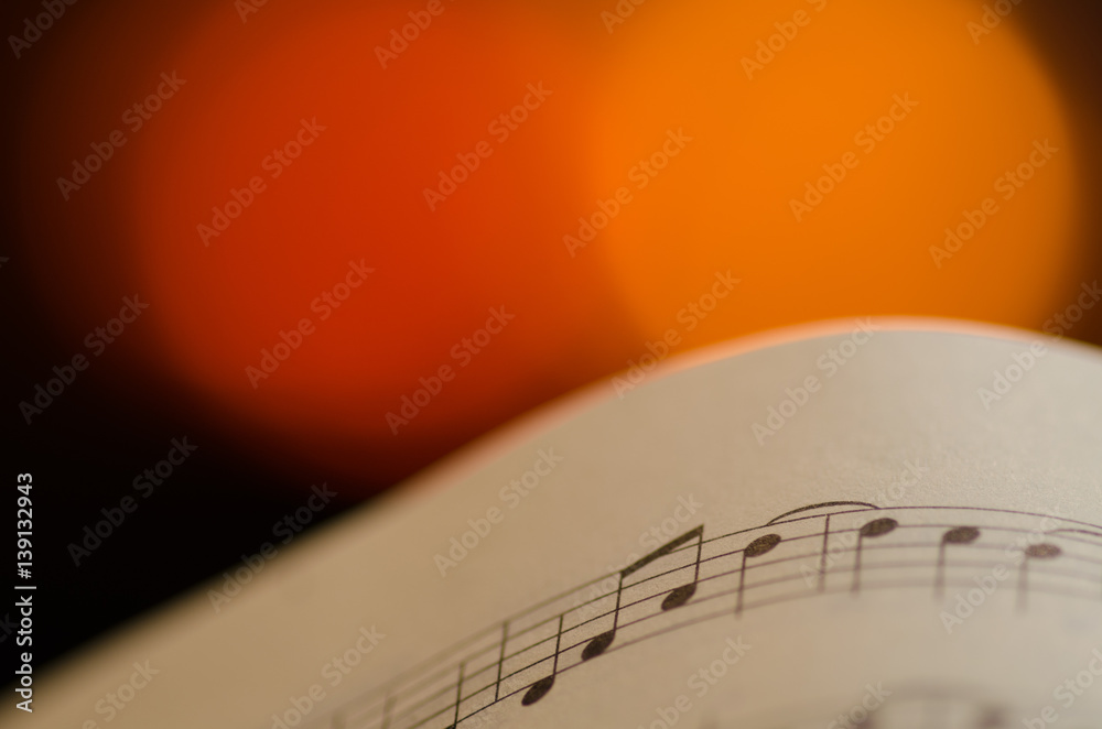 Abstract image with partiture sheet with music notes and blurred ...