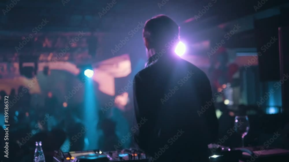DJ Turns The Records at The Modern Nightclub, Back View, Slow Motion ...