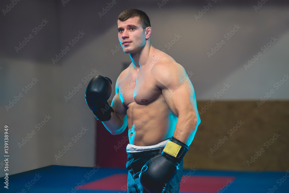 Fitness model posing in fighting stance Stock Photo | Adobe Stock