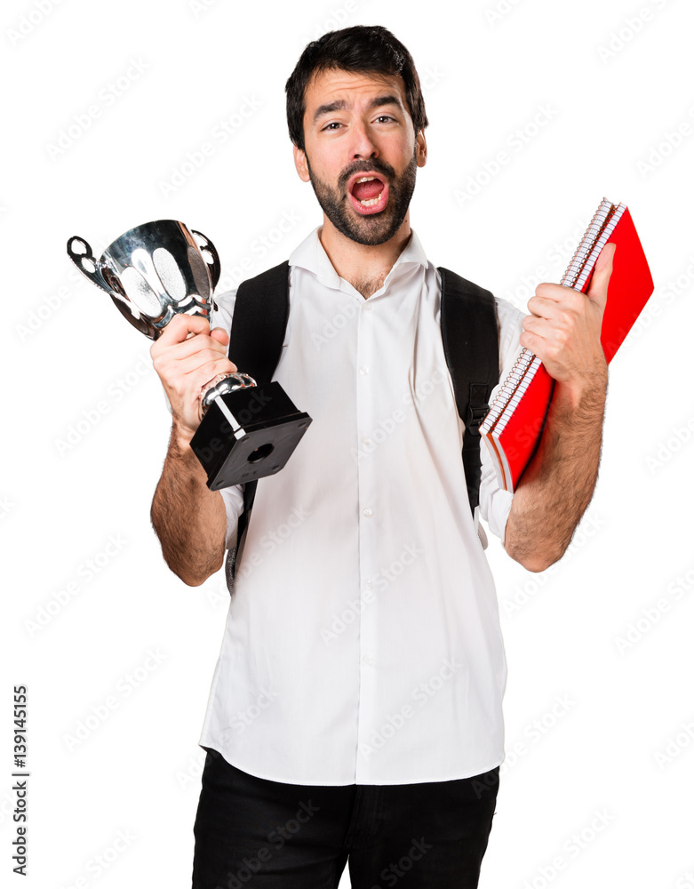 Student man holding a trophy Stock Photo | Adobe Stock