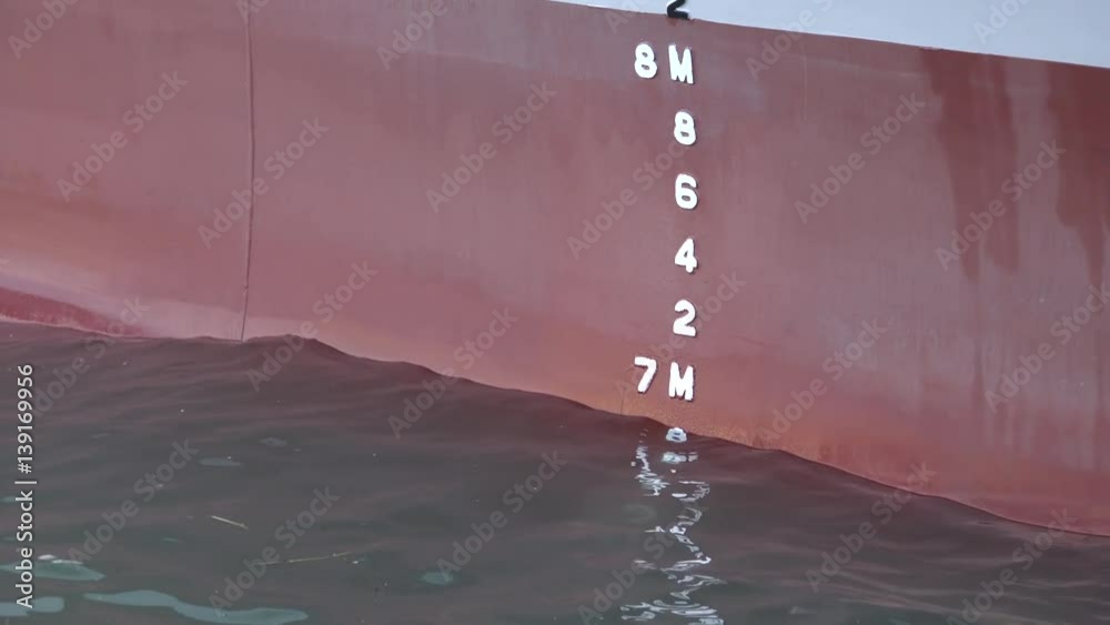 Waterline. A bulbous bow of a cargo ship in the ocean. The bulb ...