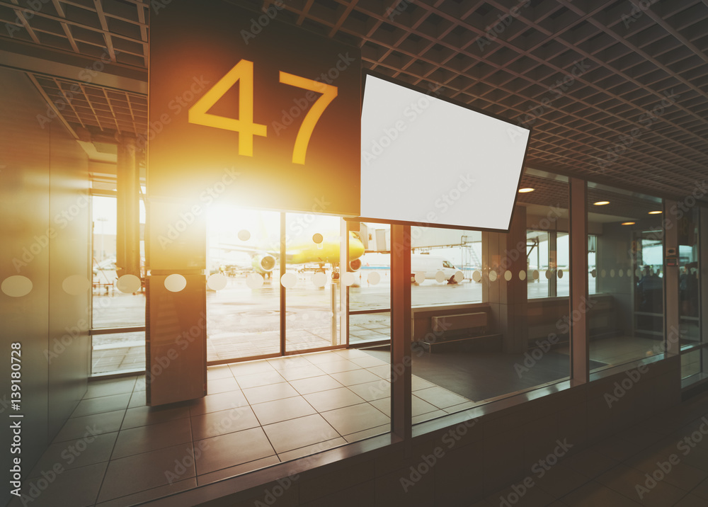 View of airport gate with digits 47 going to take-off field with mock ...