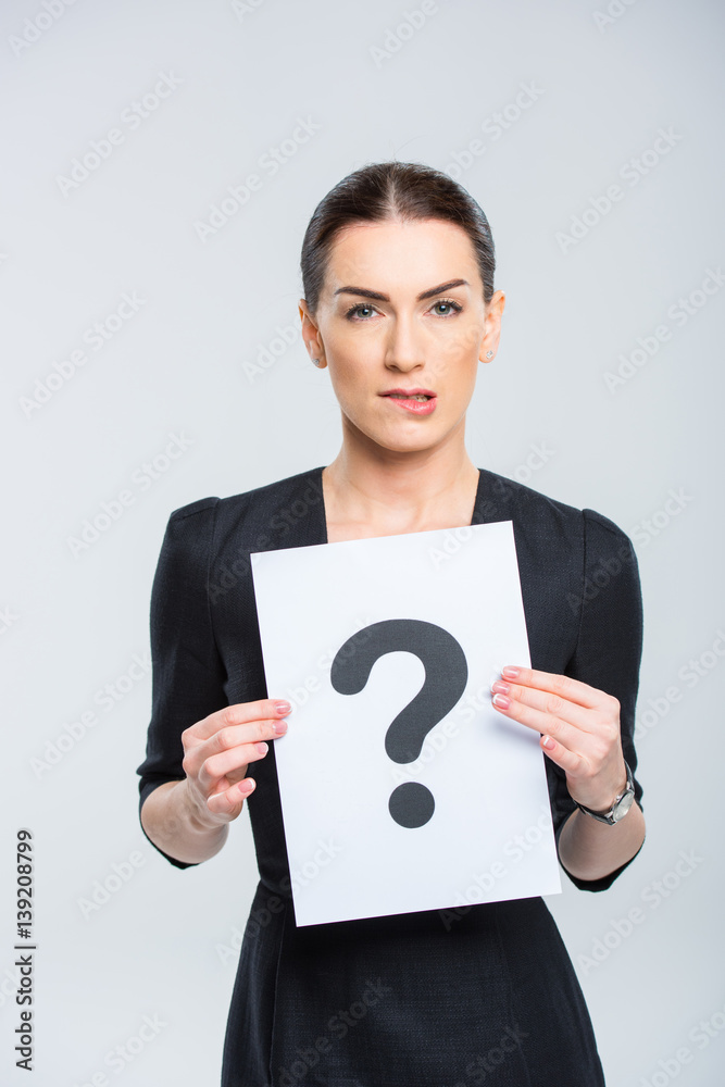 Woman holding card with question mark Stock Photo | Adobe Stock