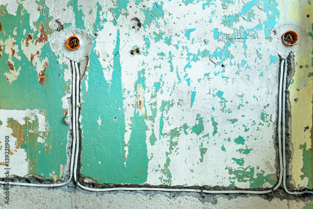 New electrical installation, socket and electrical wires on the wall ...
