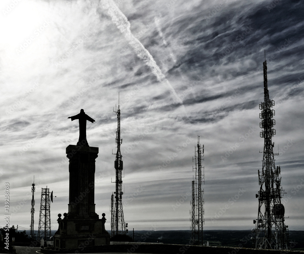 Jesus Statue blessing symbolically towers for communication Stock Photo ...