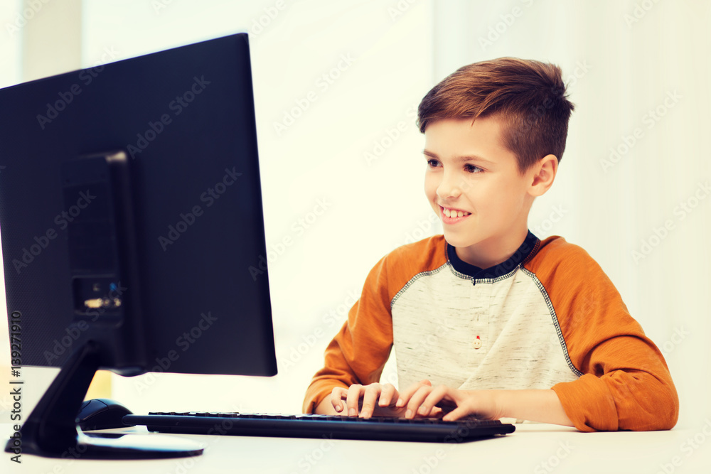 smiling boy with computer at home Stock Photo | Adobe Stock