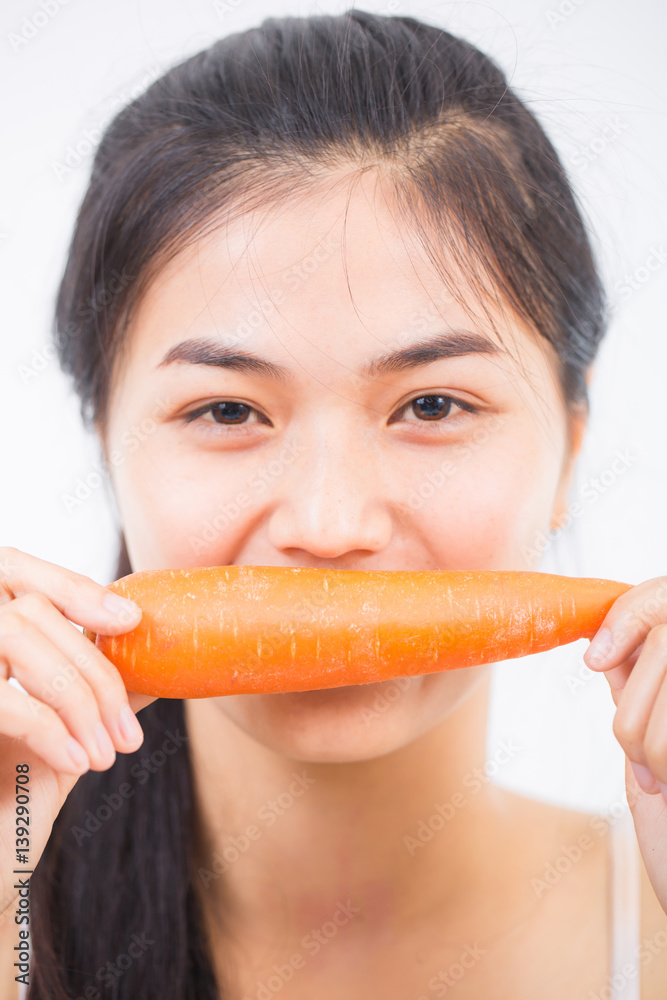 closeup woman eating carrot Stock Photo | Adobe Stock