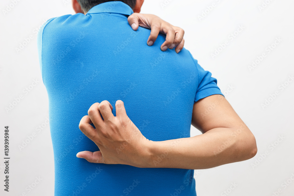 Man hands scratching the itch on the back of a white background ...