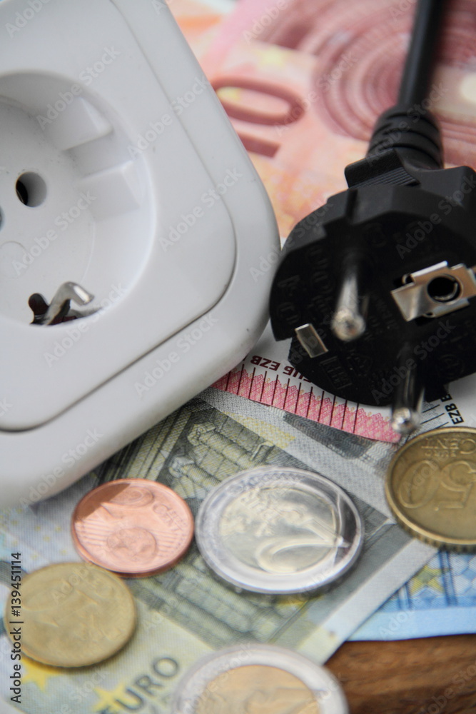 Steckdose mit Stecker und Euros im Hochformat Stock Photo | Adobe Stock