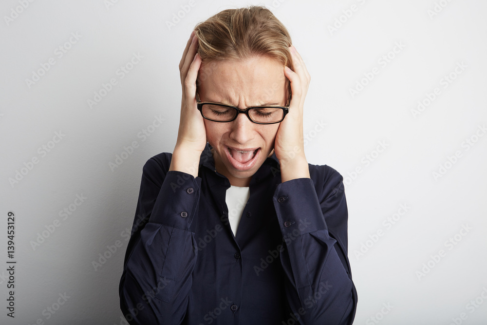 Stressed crying screaming young woman in corporate office. White ...