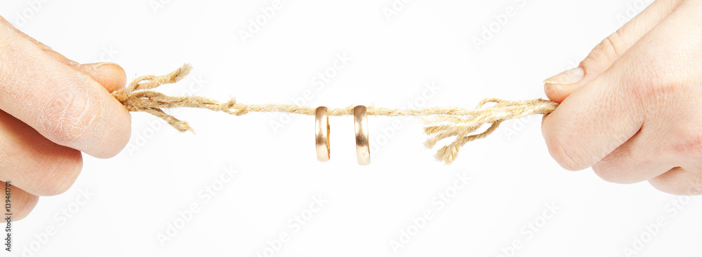 Two people pulling the rope and two golden rings in the middle of the ...
