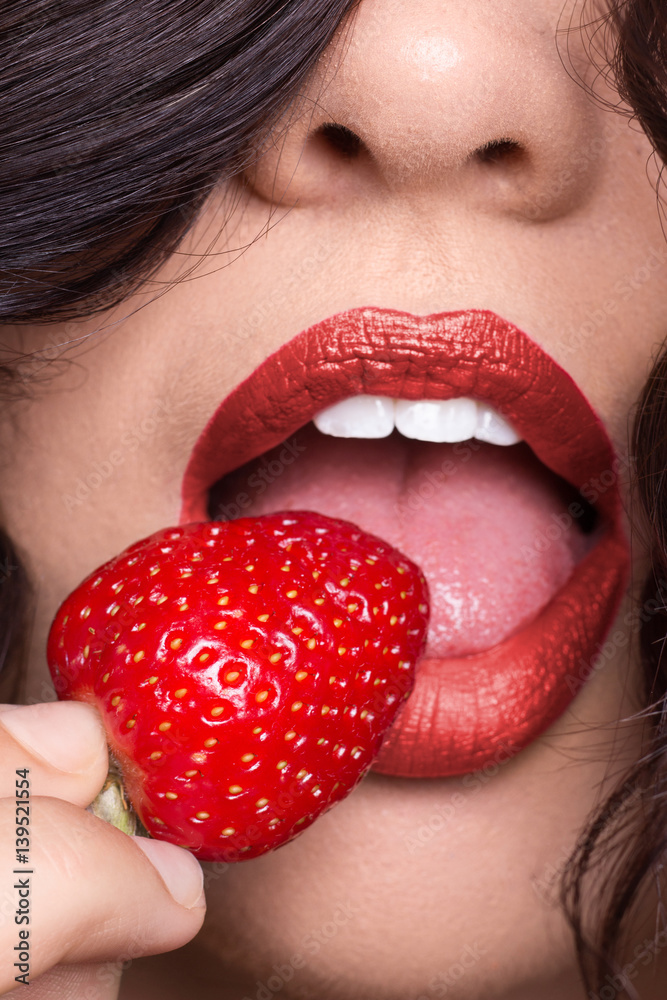 woman skin lip tongue, licking strawberry , red lipstick Stock Photo ...