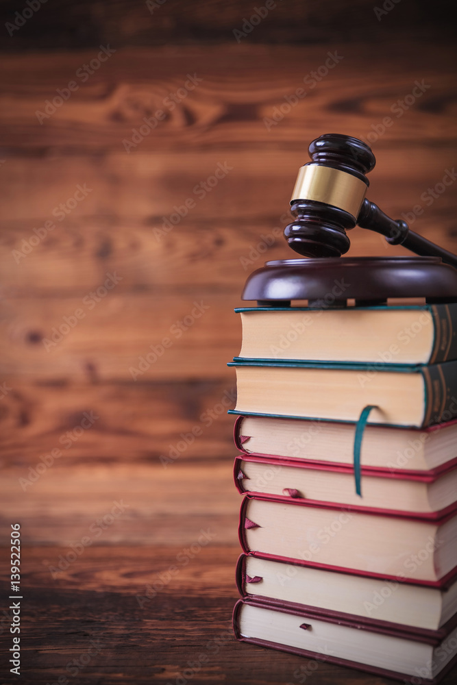 stack of law books with judge's gavel on top Stock Photo | Adobe Stock