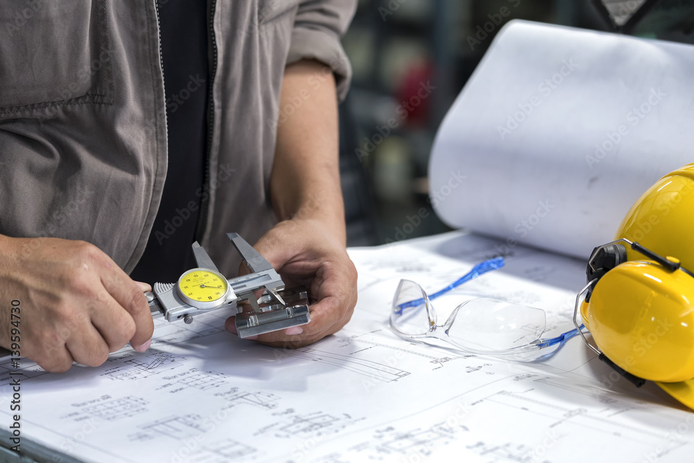 Inspection product with vernier calipers by workers Stock Photo | Adobe ...