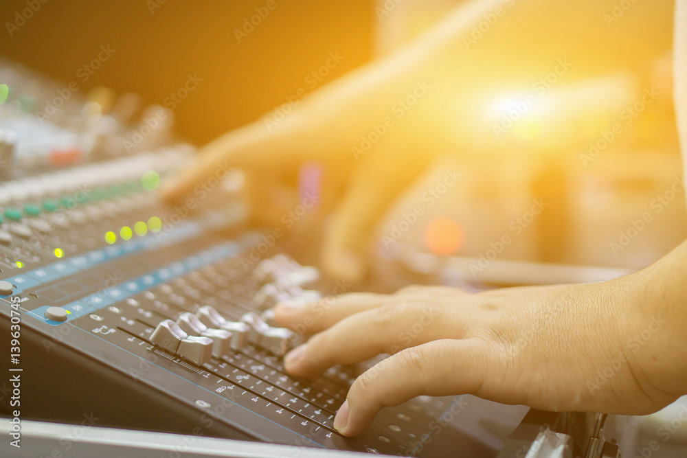 studio working with sound and light mixer console,hands of sound ...