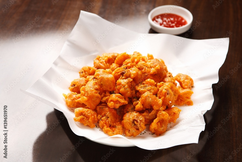 dak ddong jip tuigim is korean fried Chicken gizzard Stock Photo ...