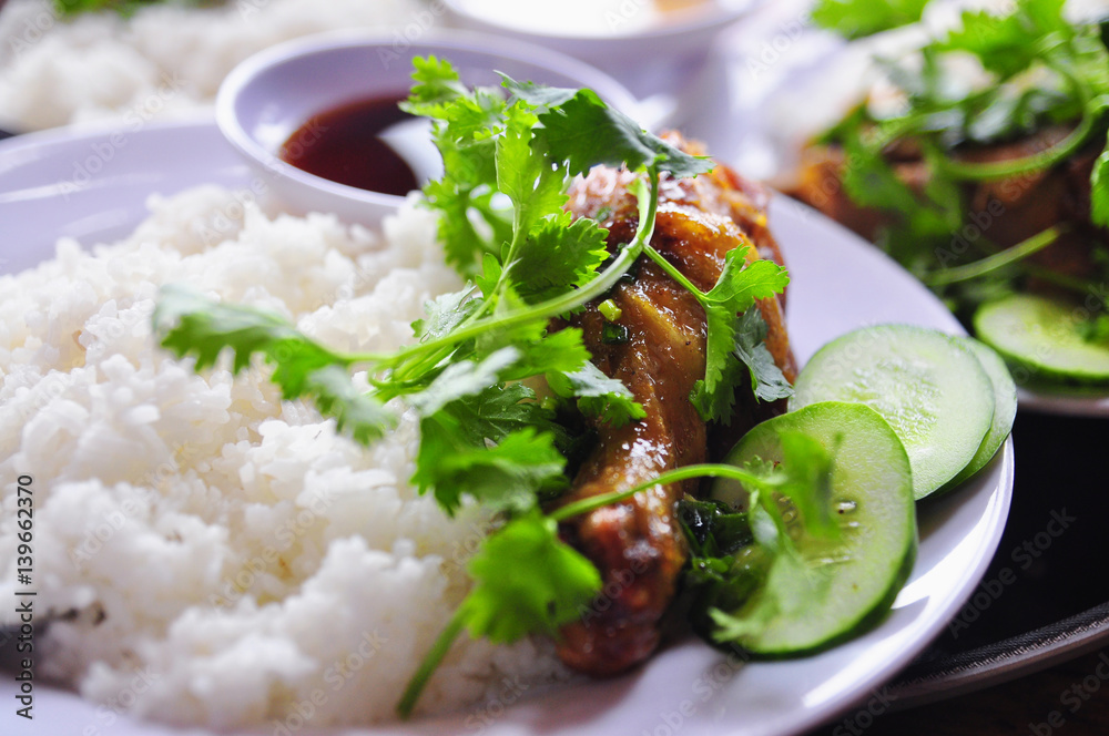 Vietnamese broken rice or com tam with fried chicken legs, pork and ...