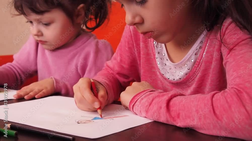 Stockvideon Children Paint Pencils Two Little Girls Draw On Paper With stockvideon-children-paint-pencils-two-little-girls-draw-on-paper-with