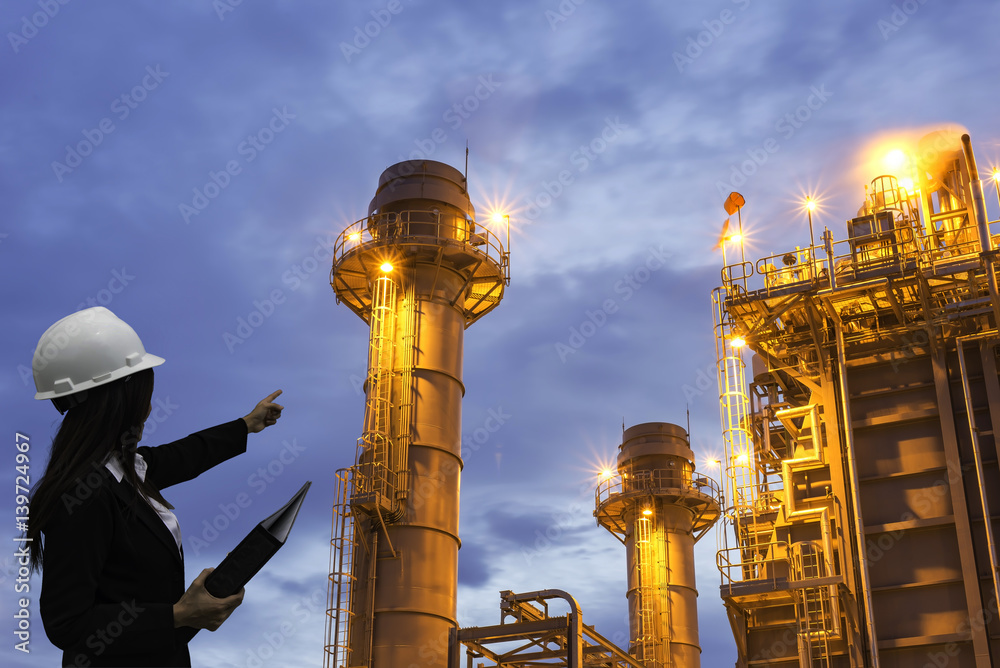 Engineer working with tablet PC near Oil Refinery,Gas turbine ...