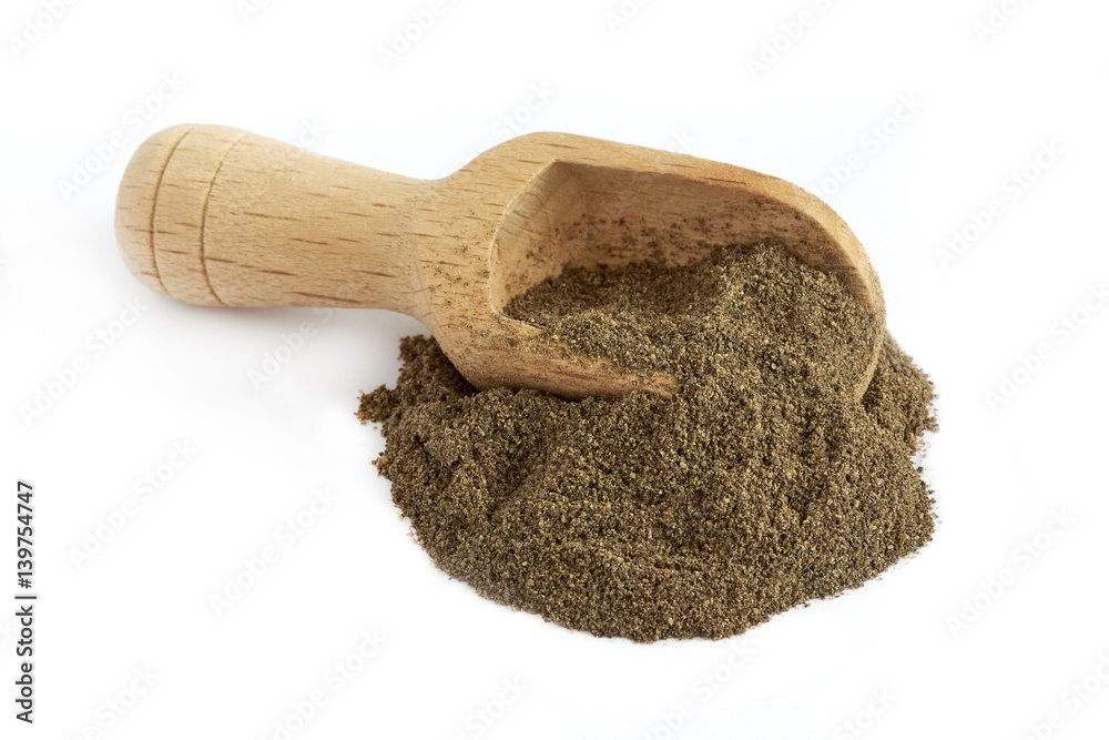 Pile of black pepper powder with wooden scoop isolated on white ...