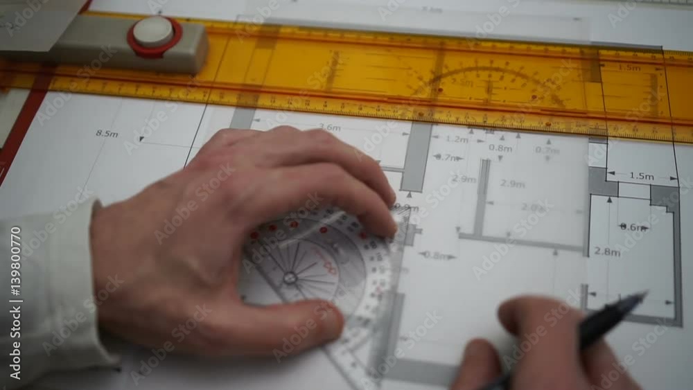 Architect drawing blueprints plan, graph, design, geometric shapes by ...