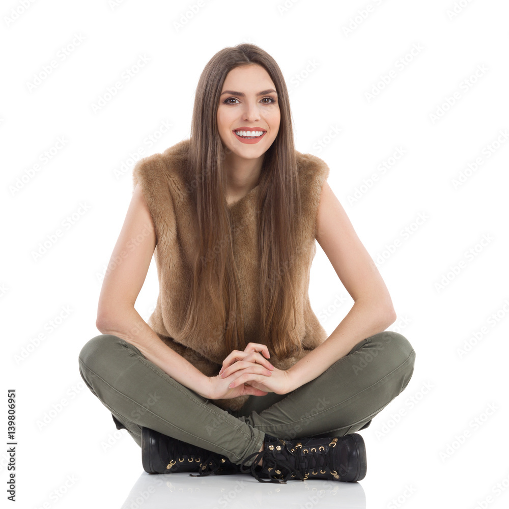 Smiling Beautiful Woman Sitting With Legs Crossed Stock-Foto | Adobe Stock