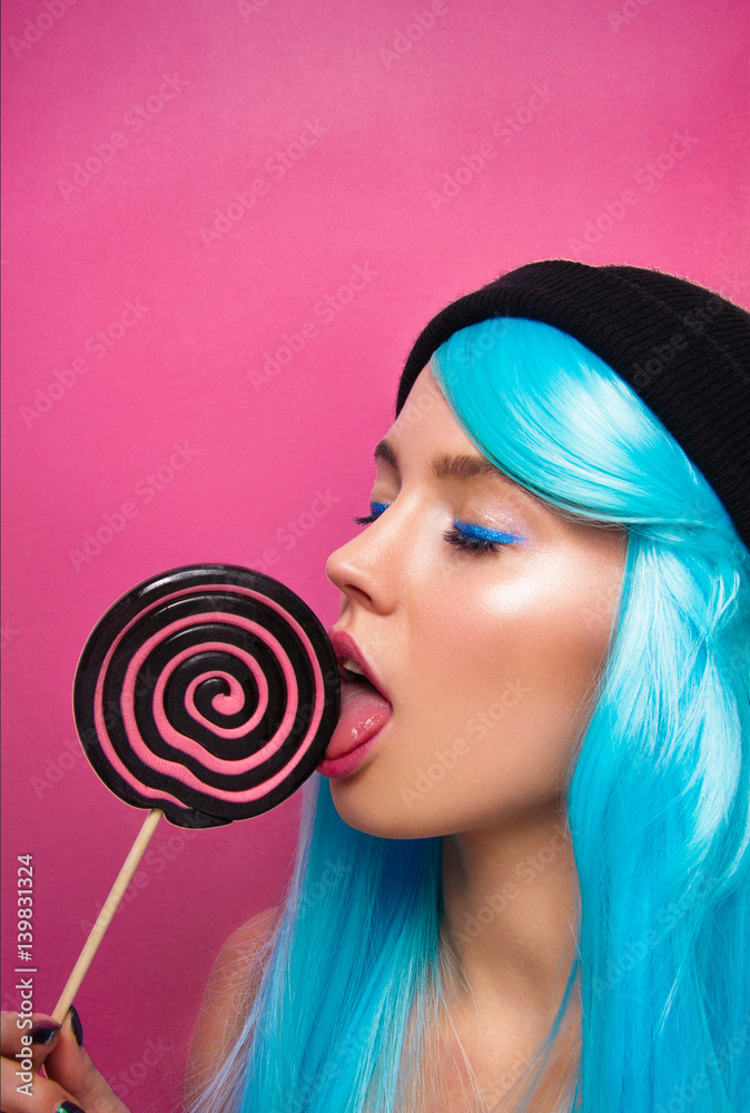 Beauty portrait of a young woman with cyan hair and creative makeup ...