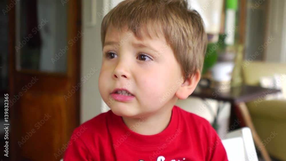 Young boy concerned about something. Child preoccupied and showing ...