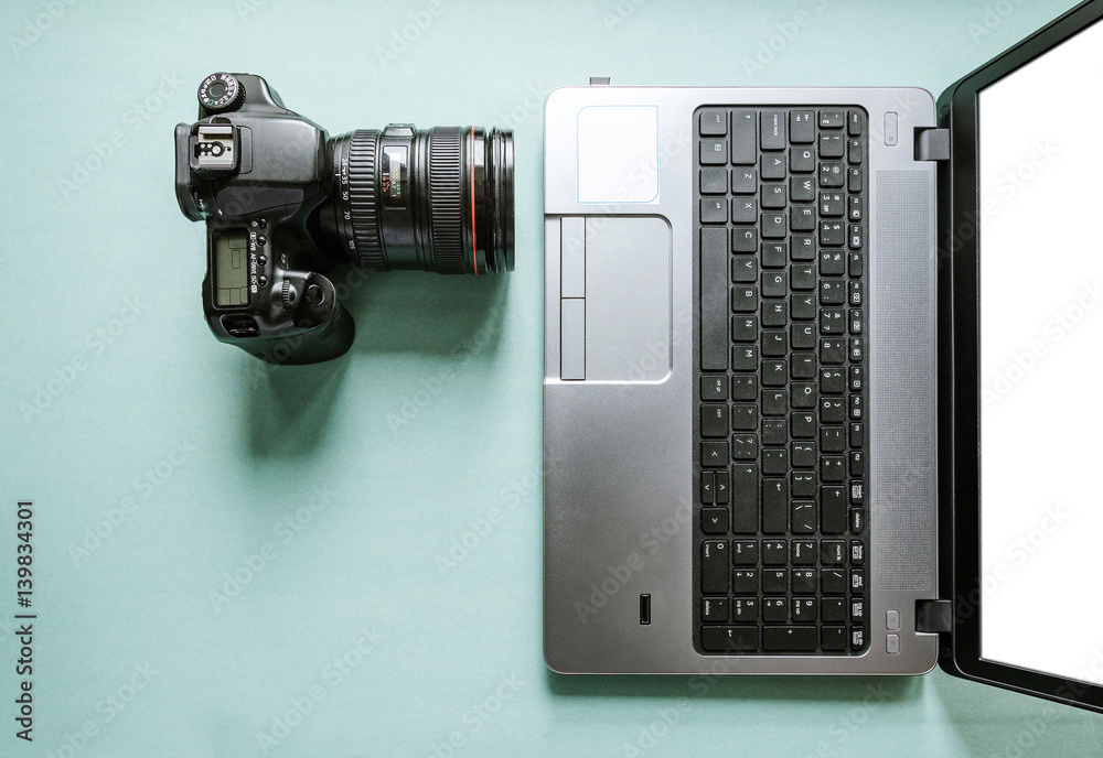 Camera and laptop top view on the aqua background ready for mockup ...