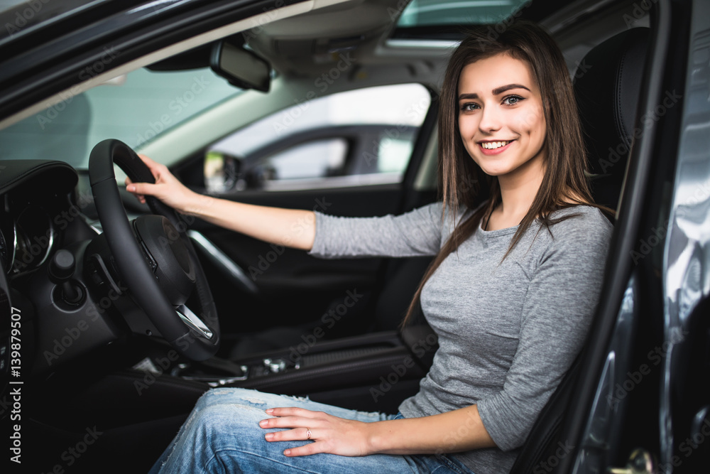 attractive woman at car drivers seat Stock Photo | Adobe Stock