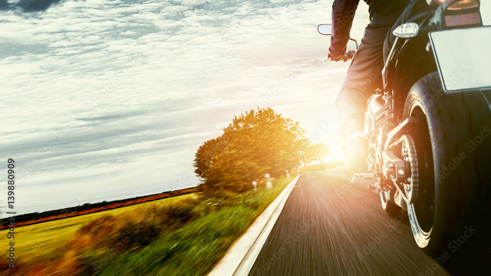 motorbike on the road riding. having fun riding the empty road on a ...