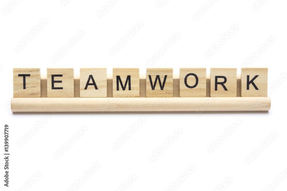 Word ''teamwork'' on scrabble wooden letters on a rack, isolated on ...