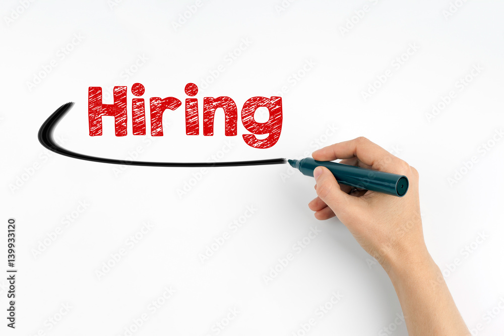 Hand with marker writing - Hiring concept. White paper background ... Hand with marker writing - Hiring concept. White paper background ...