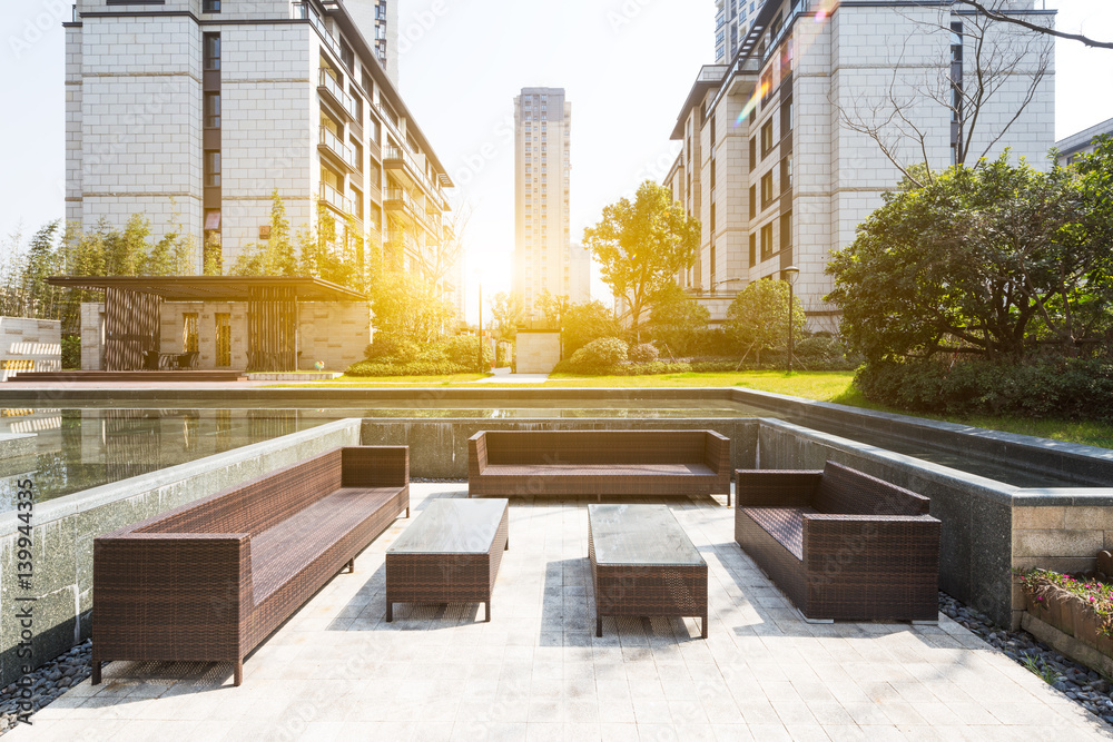 wooden benches in park and modern residential buildings Stock Photo ...