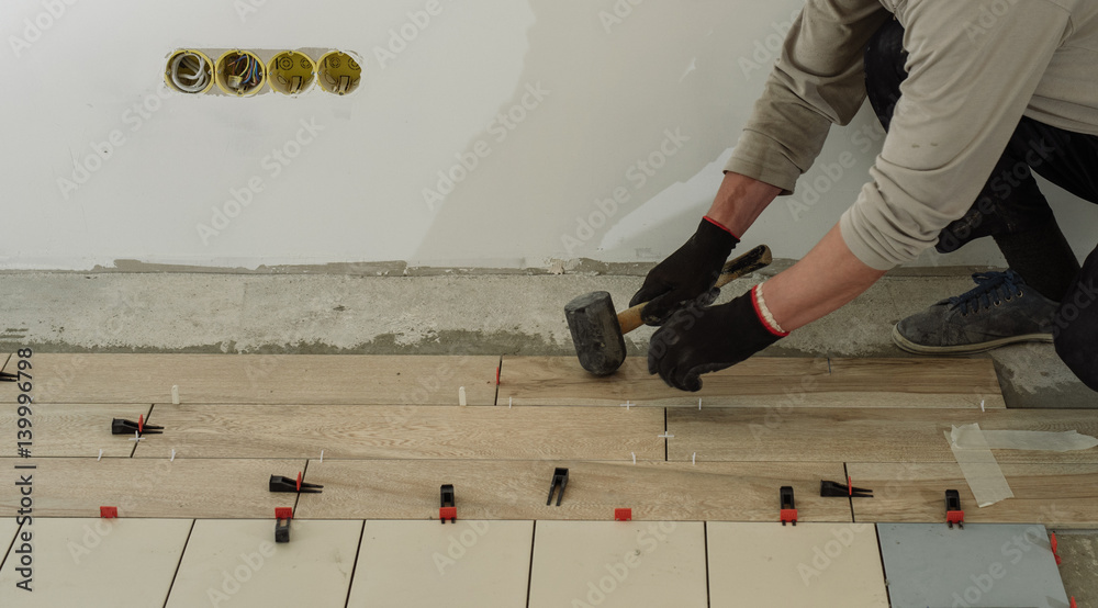 construction mason man hands on tiles work with cement mortar Stock ...
