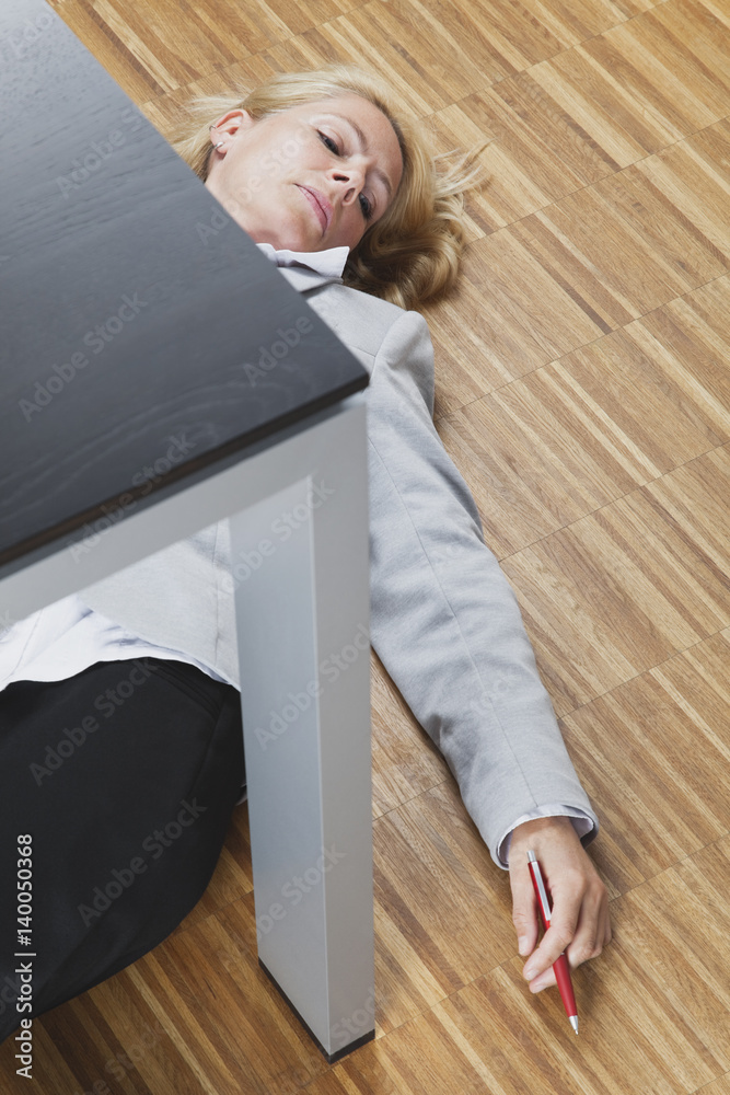 Burnout, Collapse, Business Woman lying under her office desk Stock ...