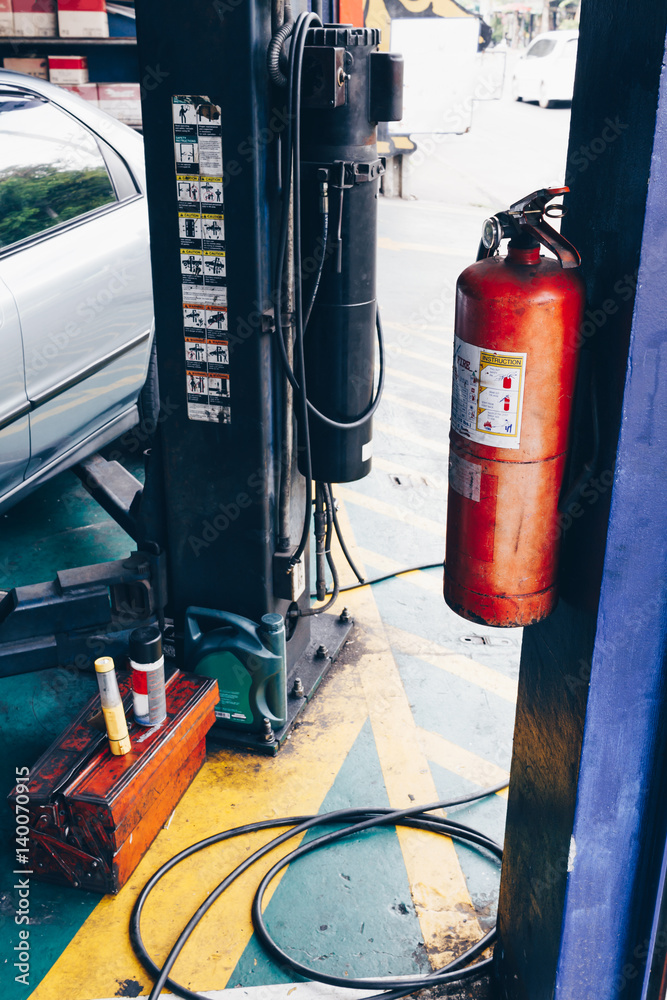 fire extinguisher in car repair station, safety first concept Stock ...