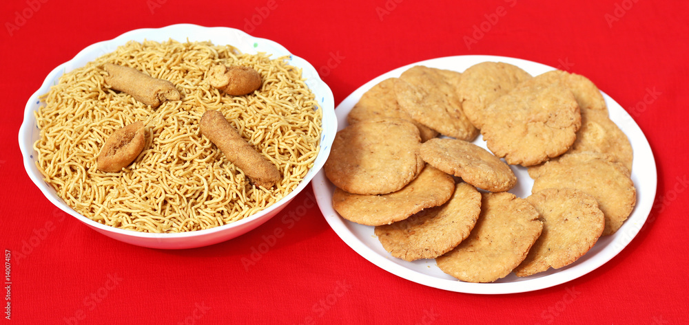 Indian Mathari made with fine wheat flour and namkeen Bikaneri Bhujiya ...