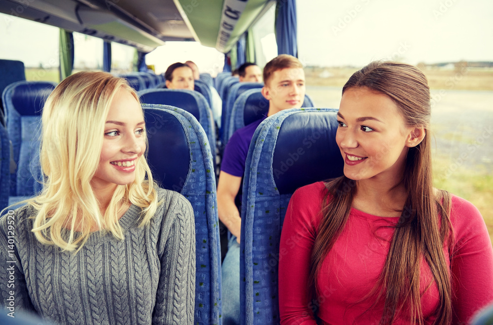 happy young women talking in travel bus Stock-Foto | Adobe Stock