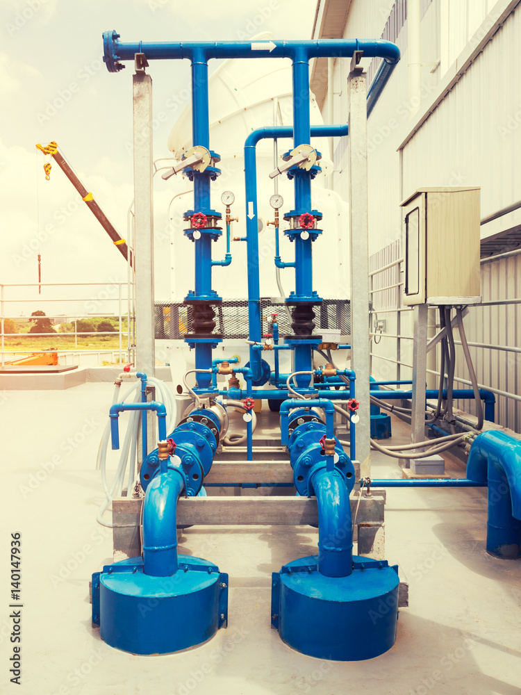 Water pump station and water cooling tower on roof deck of water tank ...