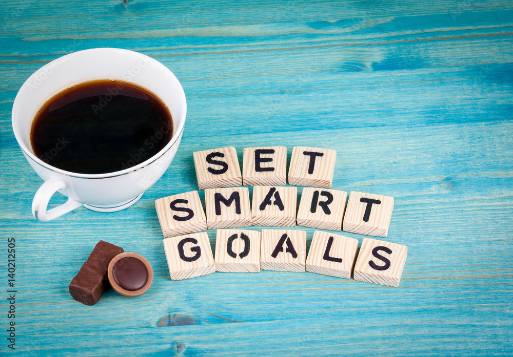 set smart goals. Coffee mug and wooden letters on wooden background ...
