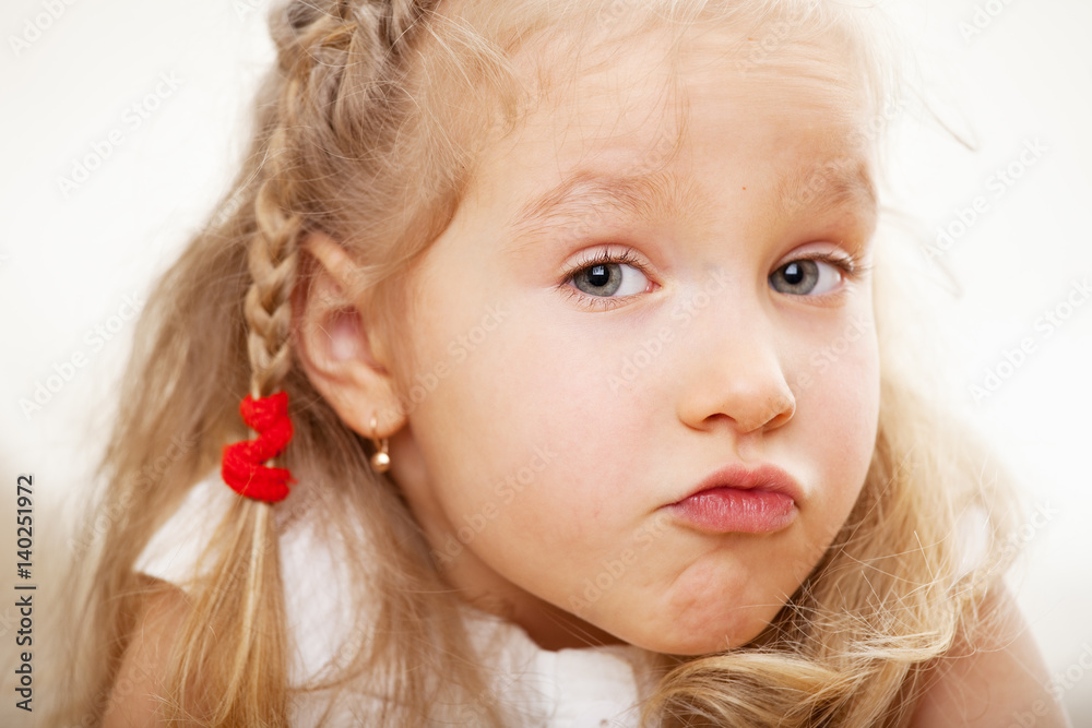 Grimacing child Stock Photo | Adobe Stock