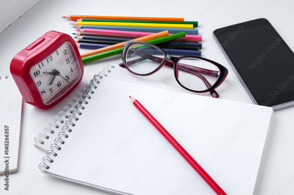 Alarm Clock, colored pencils, phone and notebook for ideas Stock Photo ...